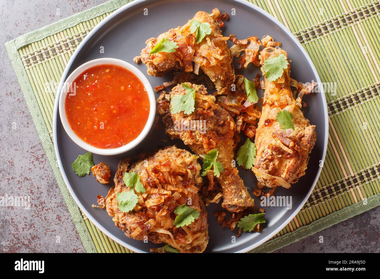 Thailand Hat Yai fried chicken with sweet chili sauce and crispy onions ...