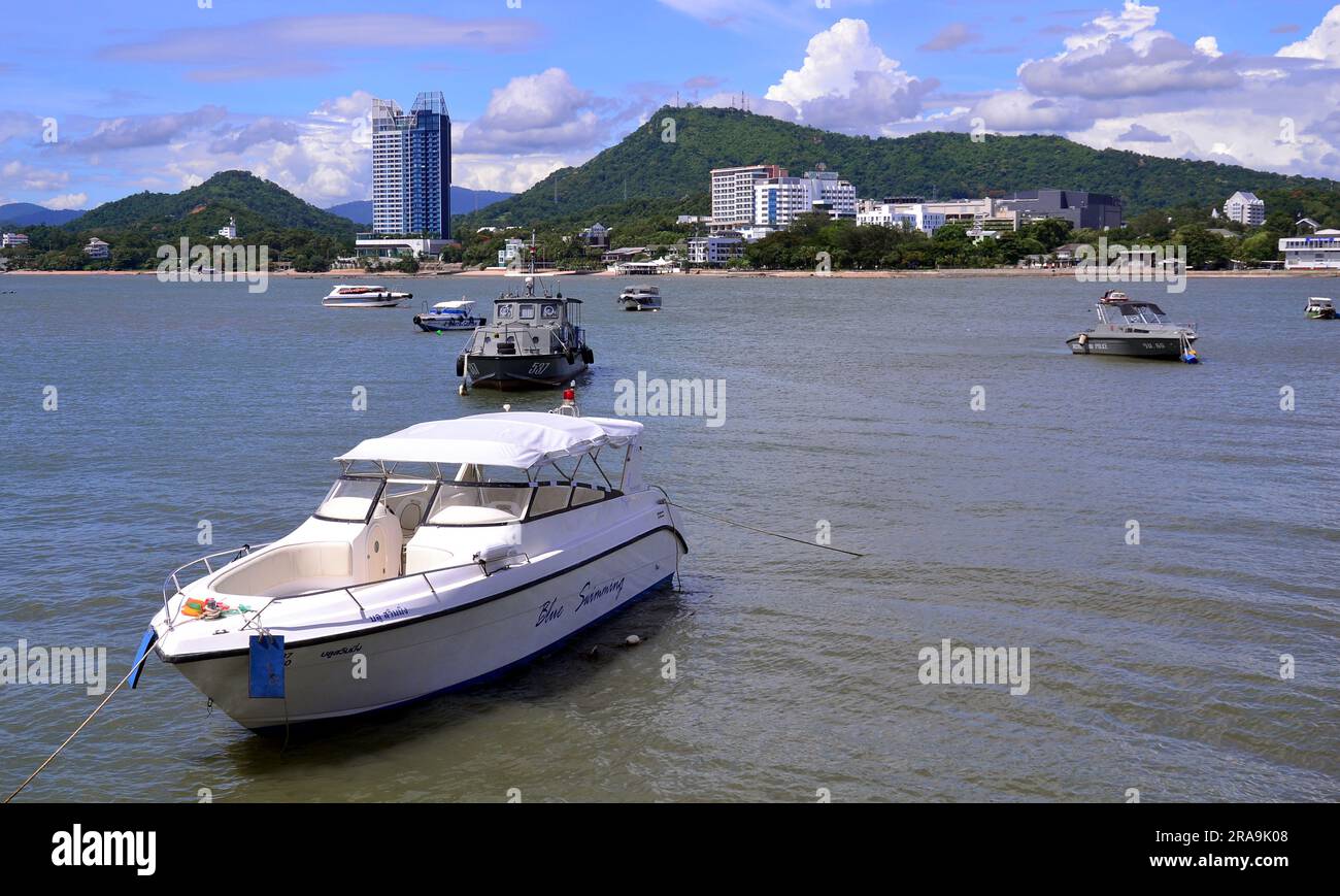 Hill and high rise buildings in the distance, boat in foreground, in ...