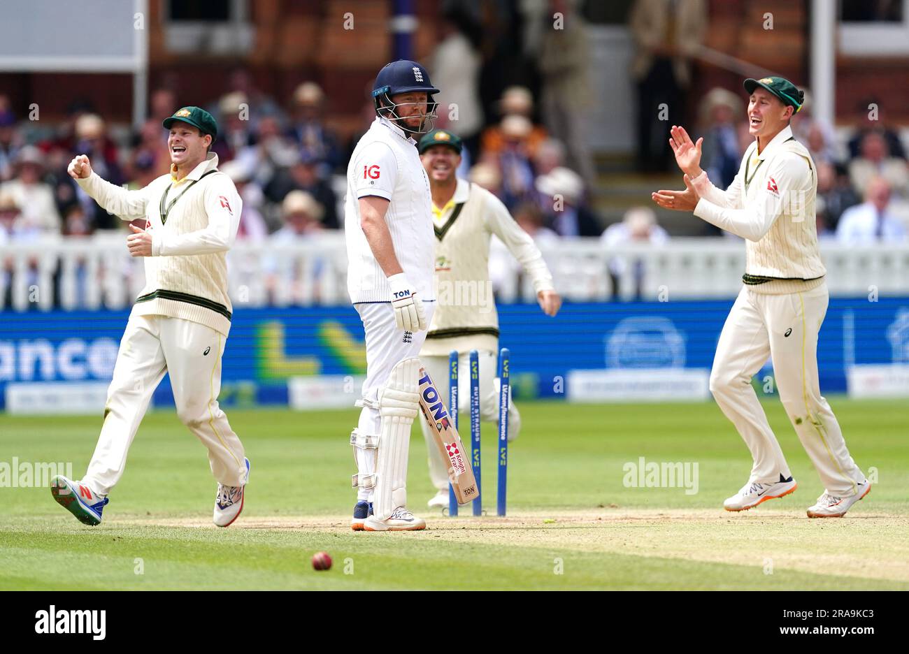 England's Jonny Bairstow (centre) looks frustrated after being run out ...