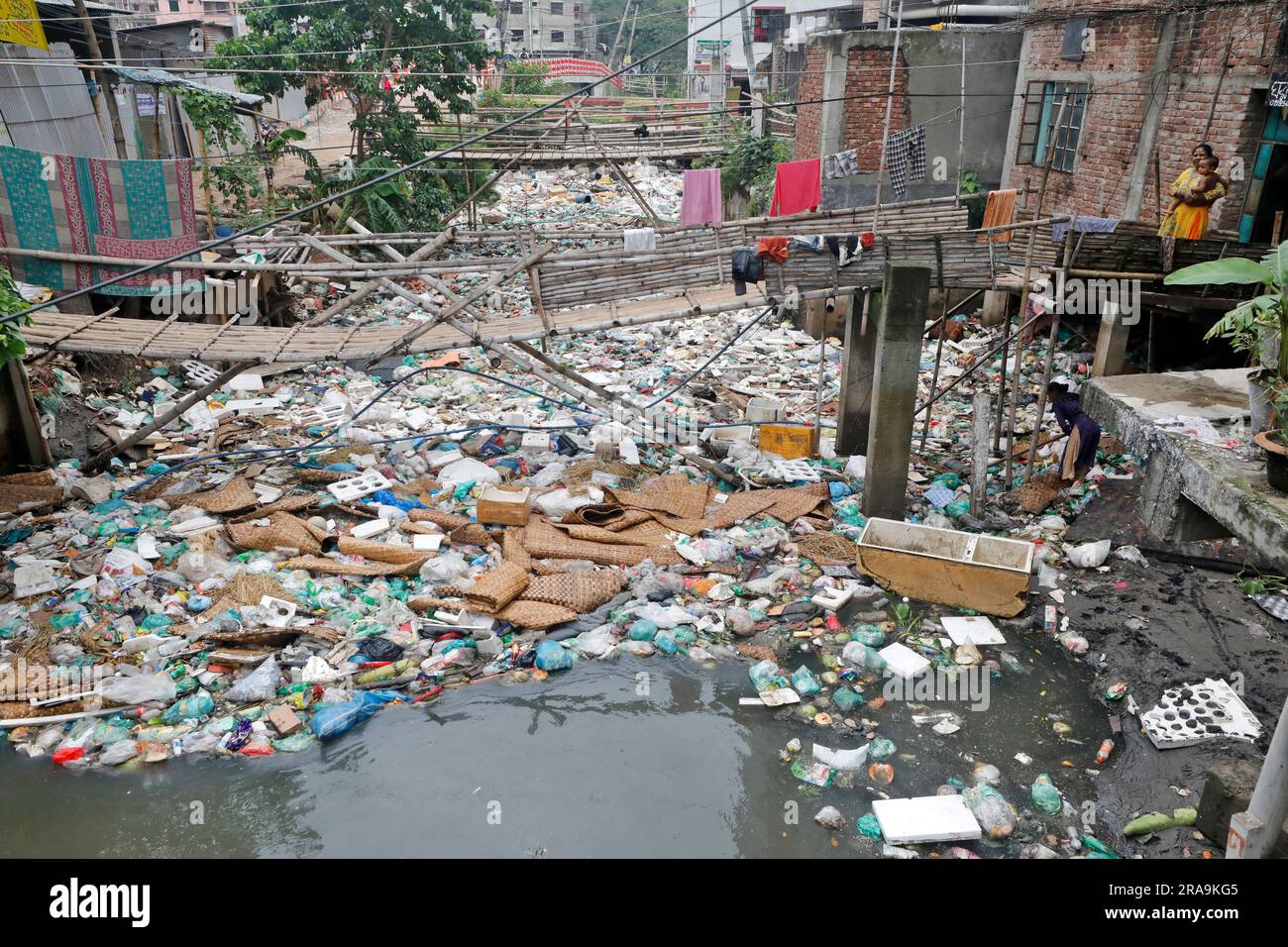 Dhaka, Bangladesh, - July 02, 2023: A canal full with wastage plastic ...