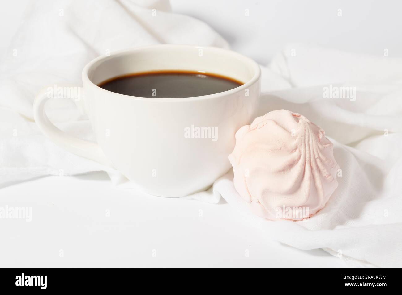 Delicious morning coffee on white with marshmallow Stock Photo - Alamy