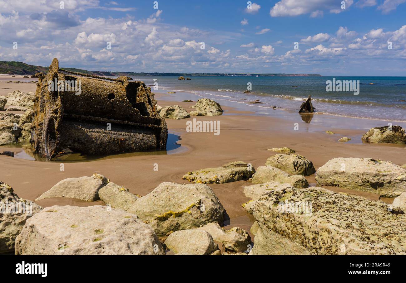 Rusting old ship's boiler at the foot of the chalk cliffs at the end of ...