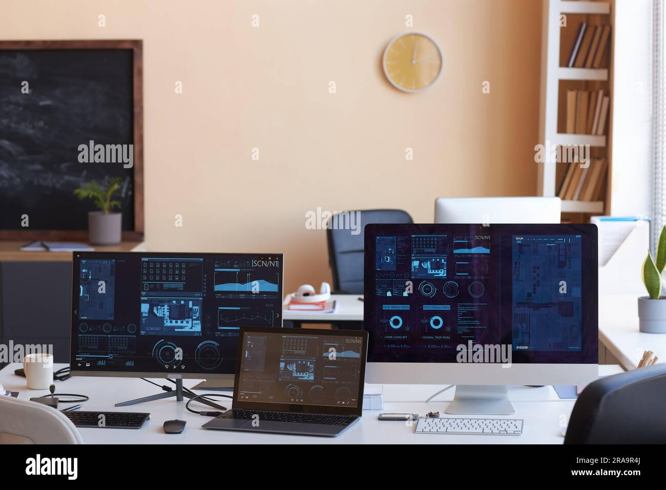 Financial graphs and charts on screens of desktop computers standing on ...