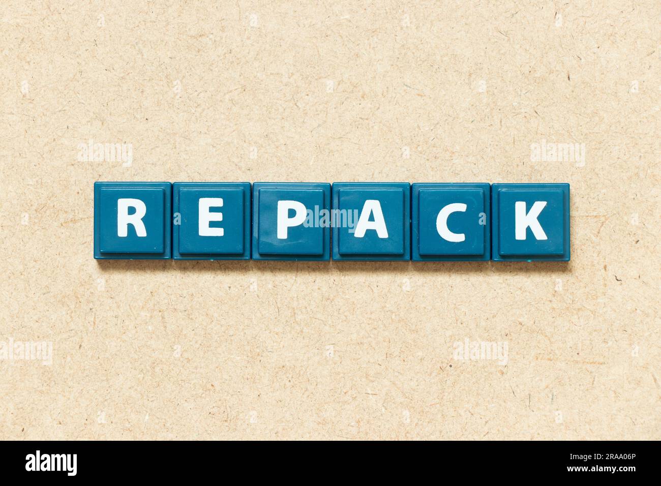 Tile alphabet letter in word repack on wood background Stock Photo - Alamy