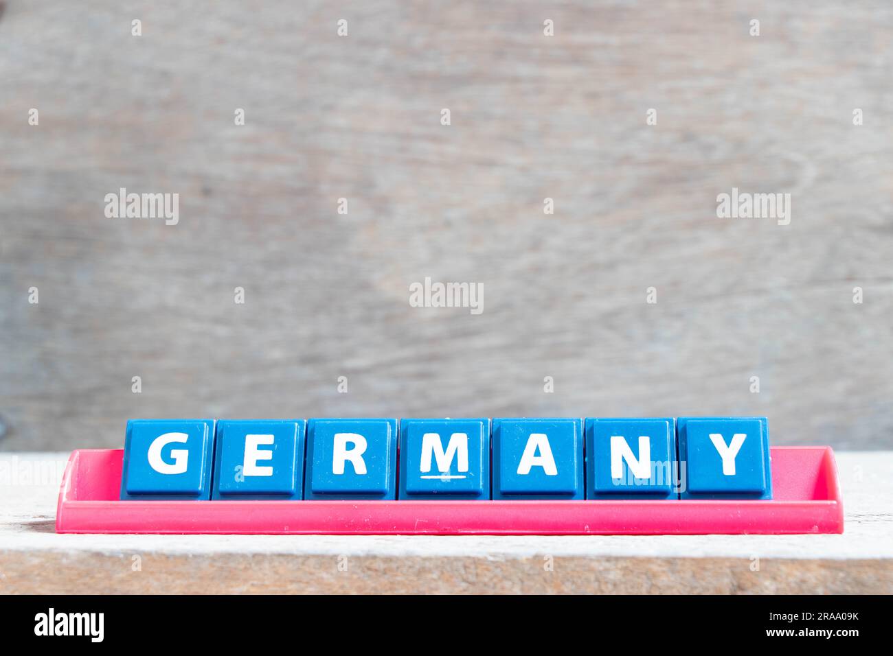 Tile alphabet letter with word germany in red color rack on wood ...