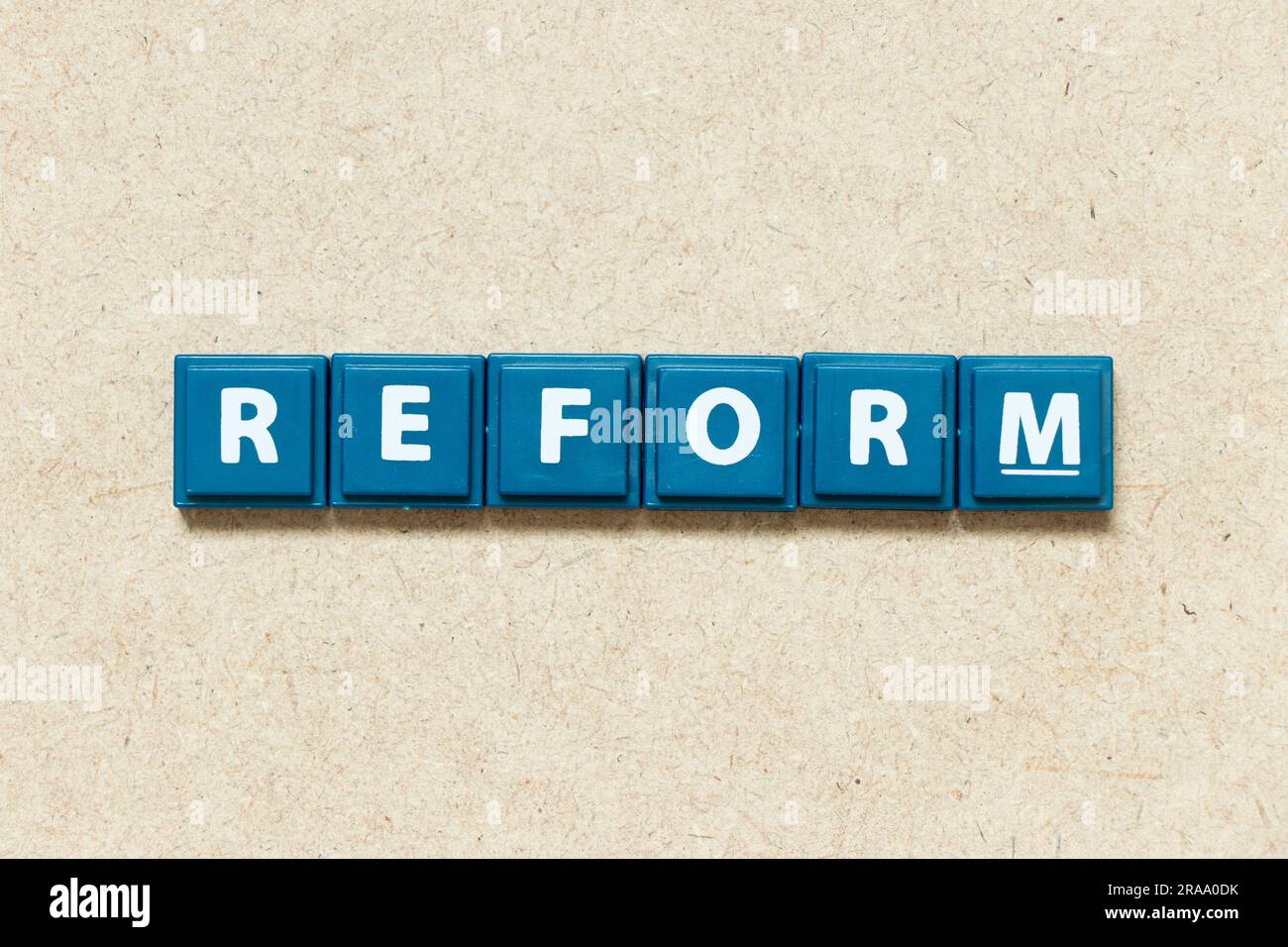 Tile alphabet letter in word reform on wood background Stock Photo - Alamy