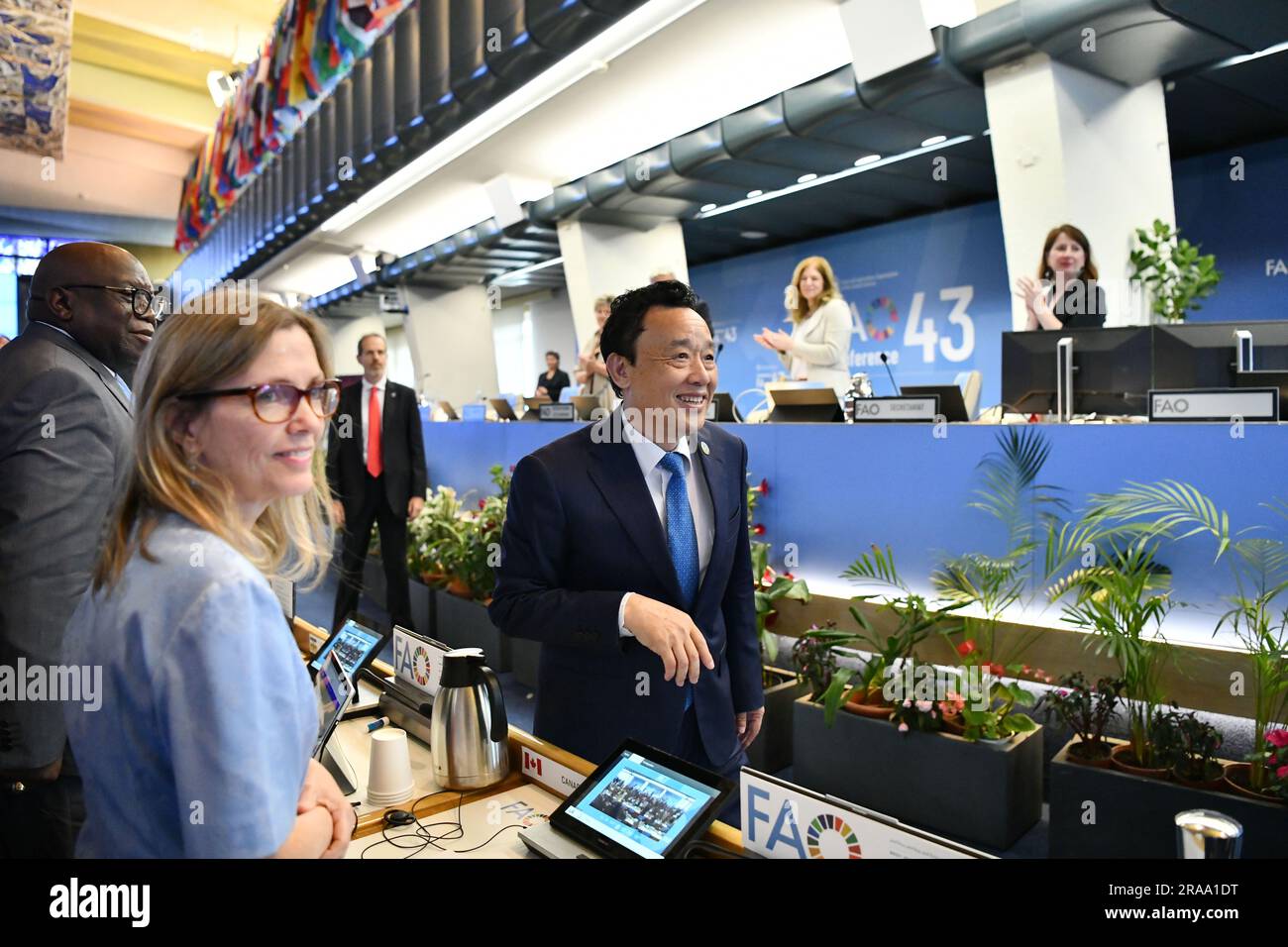 Rome, Italy. 2nd July, 2023. Qu Dongyu (C) receives congratulations ...