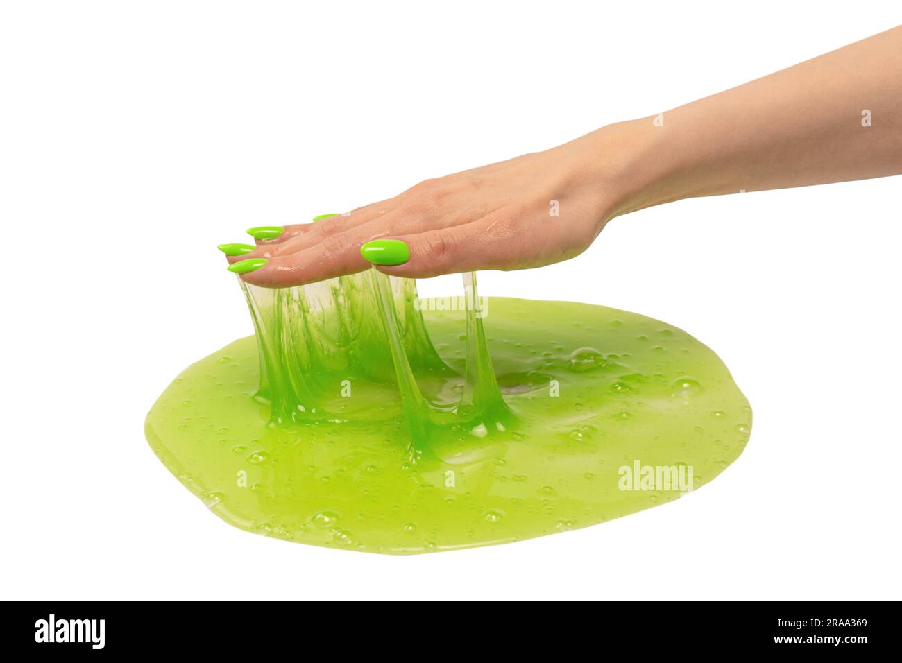 Green slime toy in woman hand with green nails isolated on a white ...
