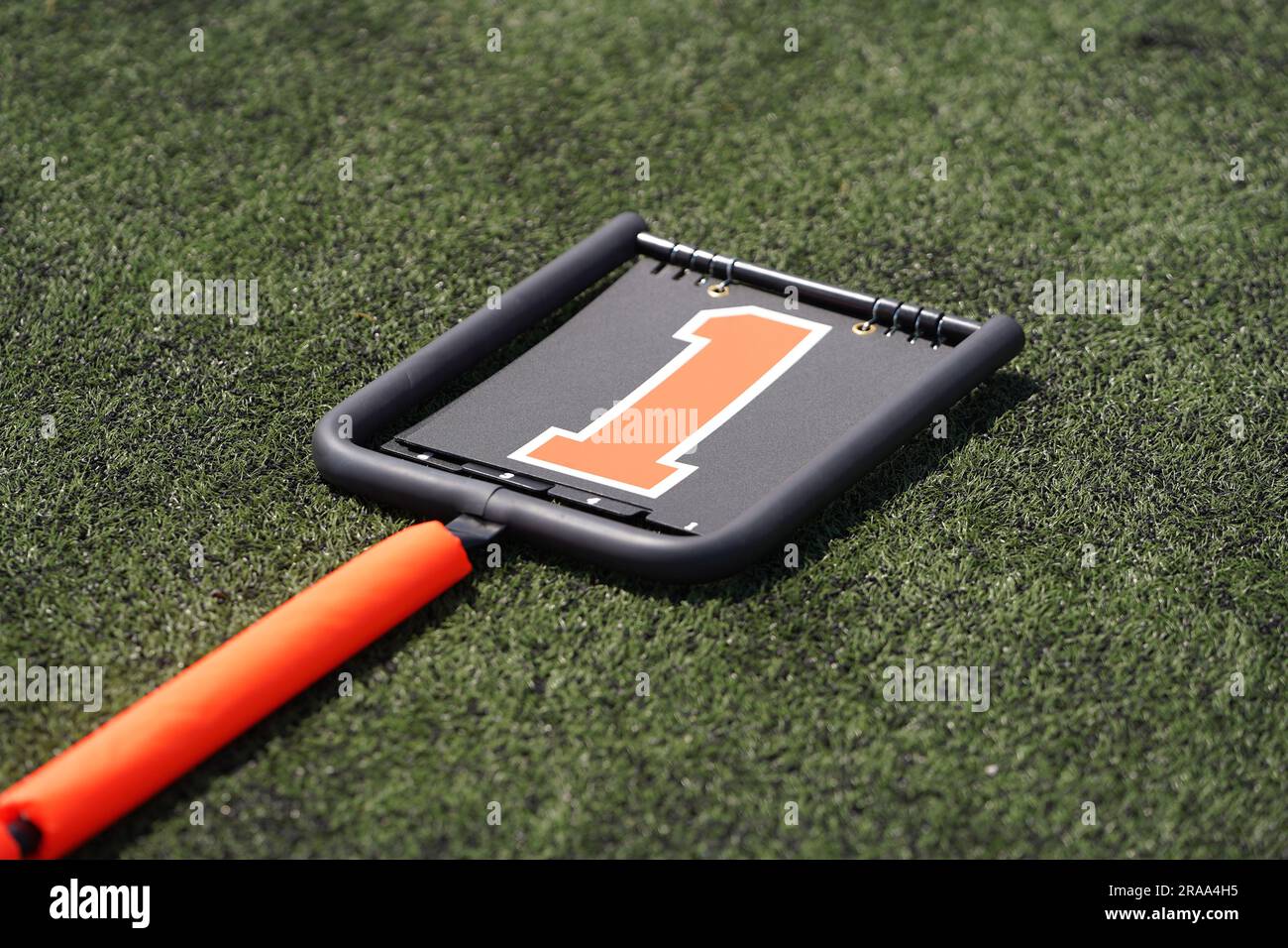 Down marker showing first down on artificial grass Stock Photo - Alamy