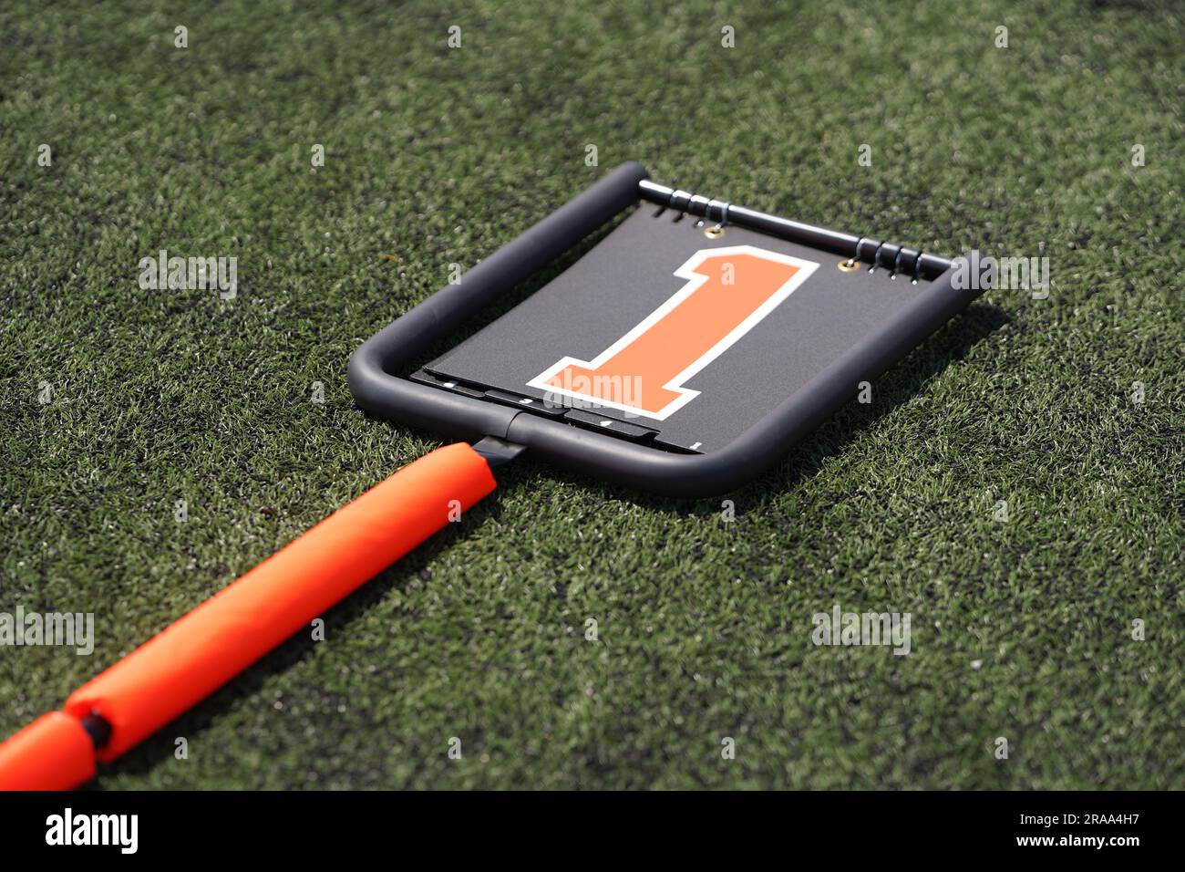 Down marker showing first down on artificial grass Stock Photo - Alamy
