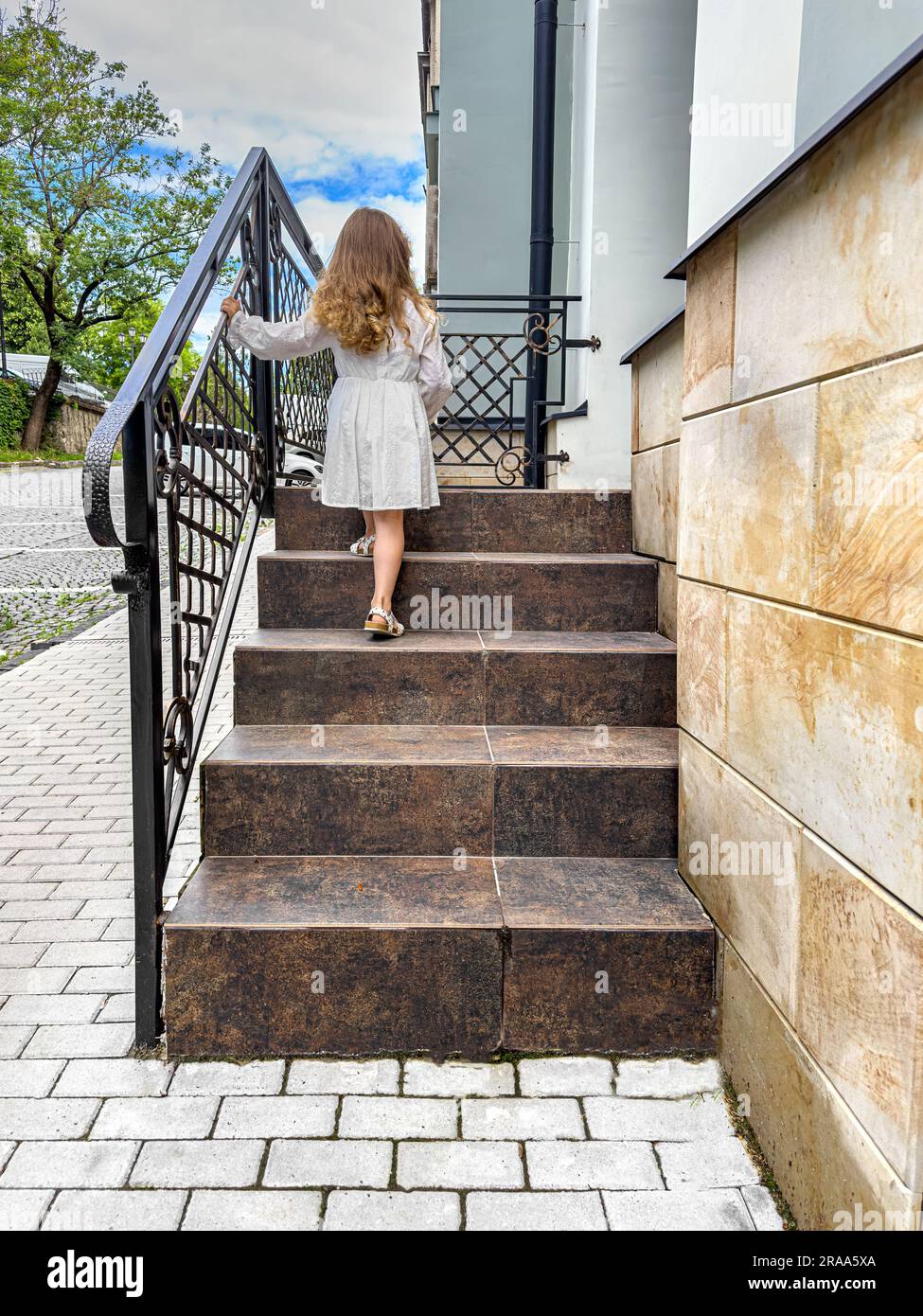 Woman climbing stairs jeans hi-res stock photography and images - Alamy