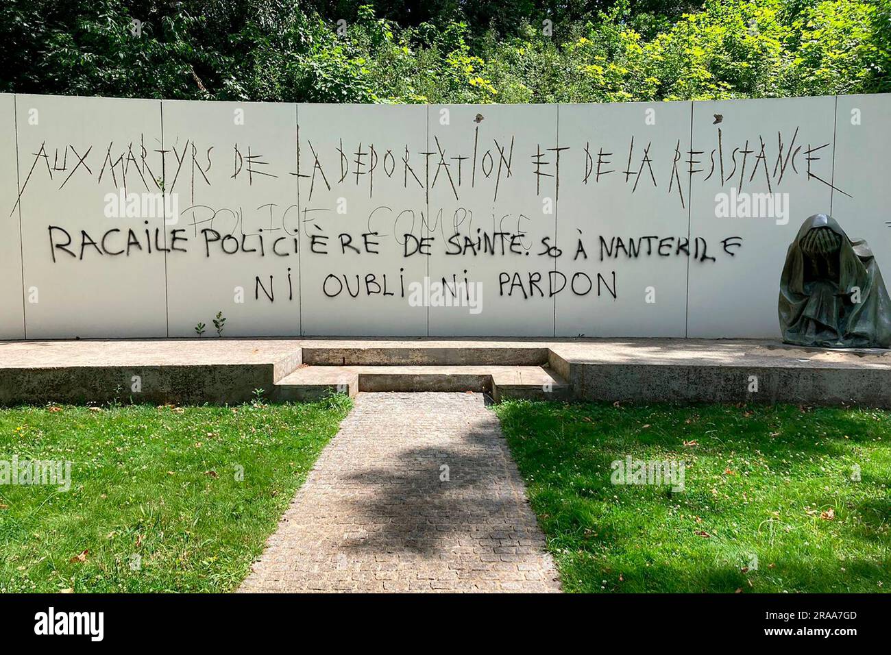A graffiti reading "Police scum from Saint-Soline to Nanterre - do not ...