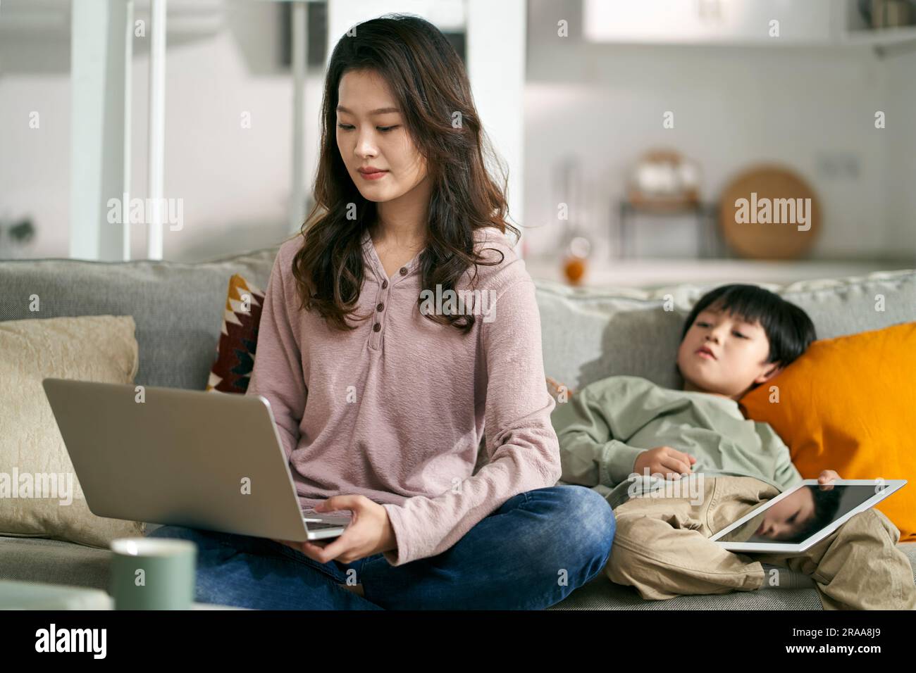 Working mother with her child hi-res stock photography and images - Alamy