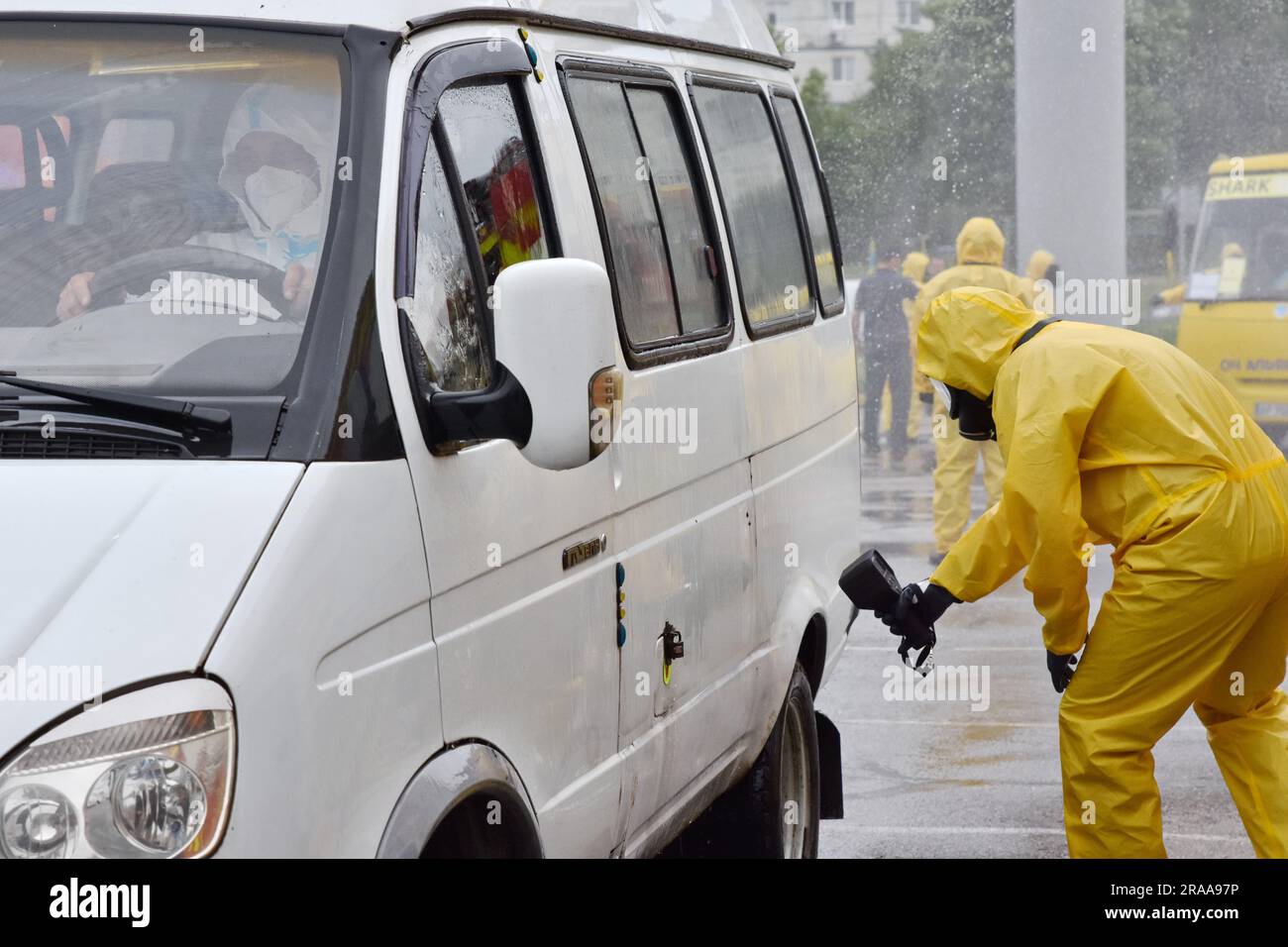 A Ukrainian emergency worker wearing a radiation protection suit checks ...