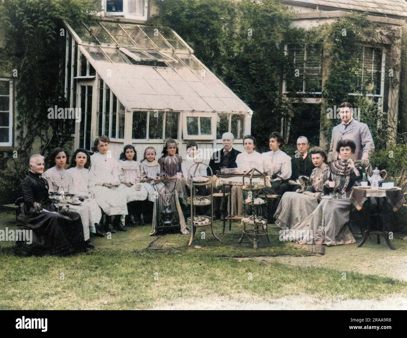 A group of people, both young and old, sit in a semi circle, at a ...