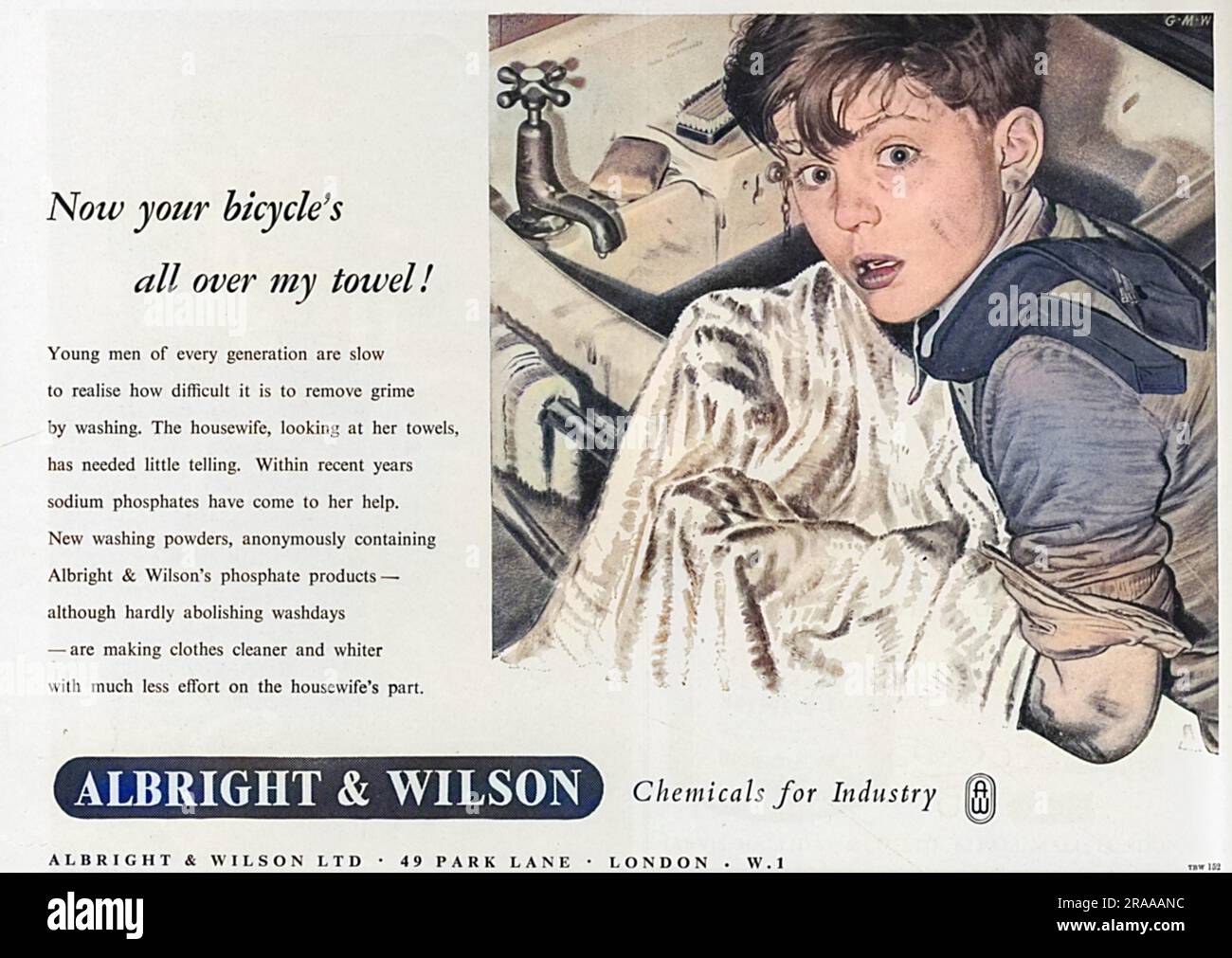 A boy looks up rather guiltily, having been caught drying his face and ...