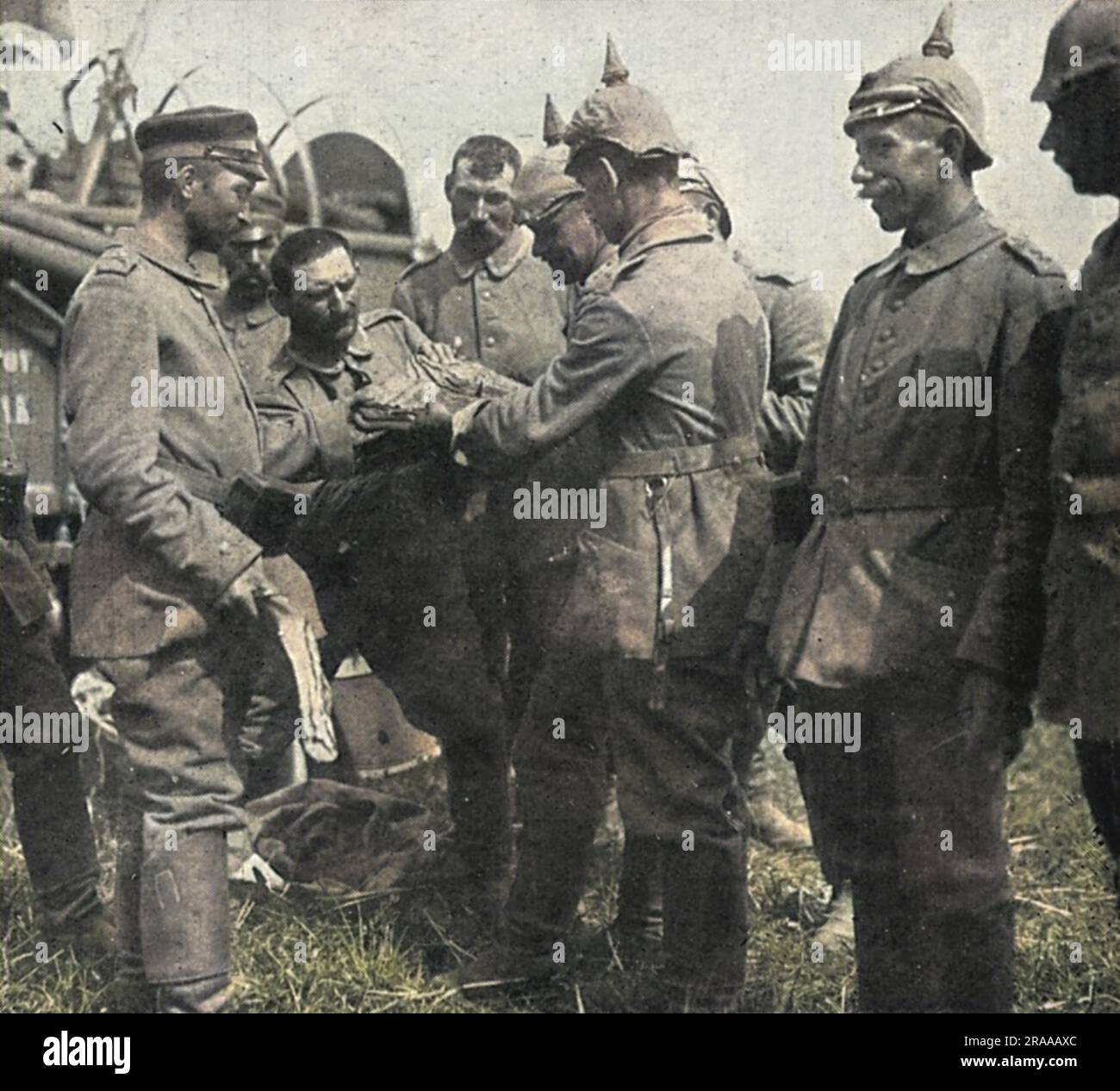 Rations of bread and ham are served out to German soldiers during a ...