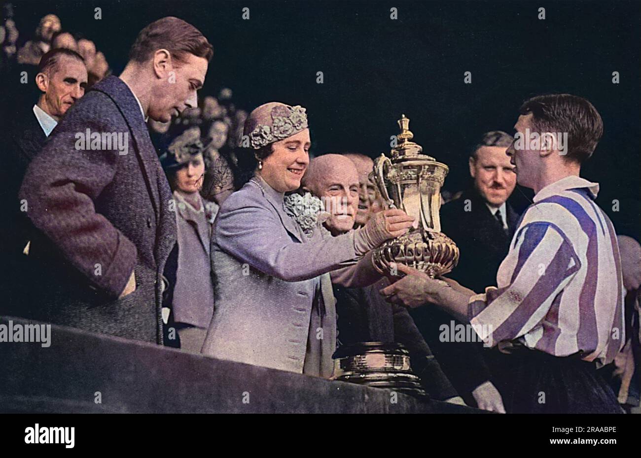 George VI and Queen Elizabeth present the FA Cup to Raich Carter ...