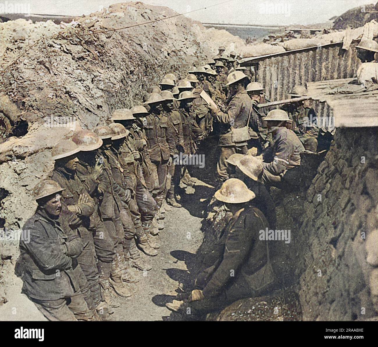 British soldiers in a trench on the first day of the Somme (1 July 1916), lining up for a roll ...
