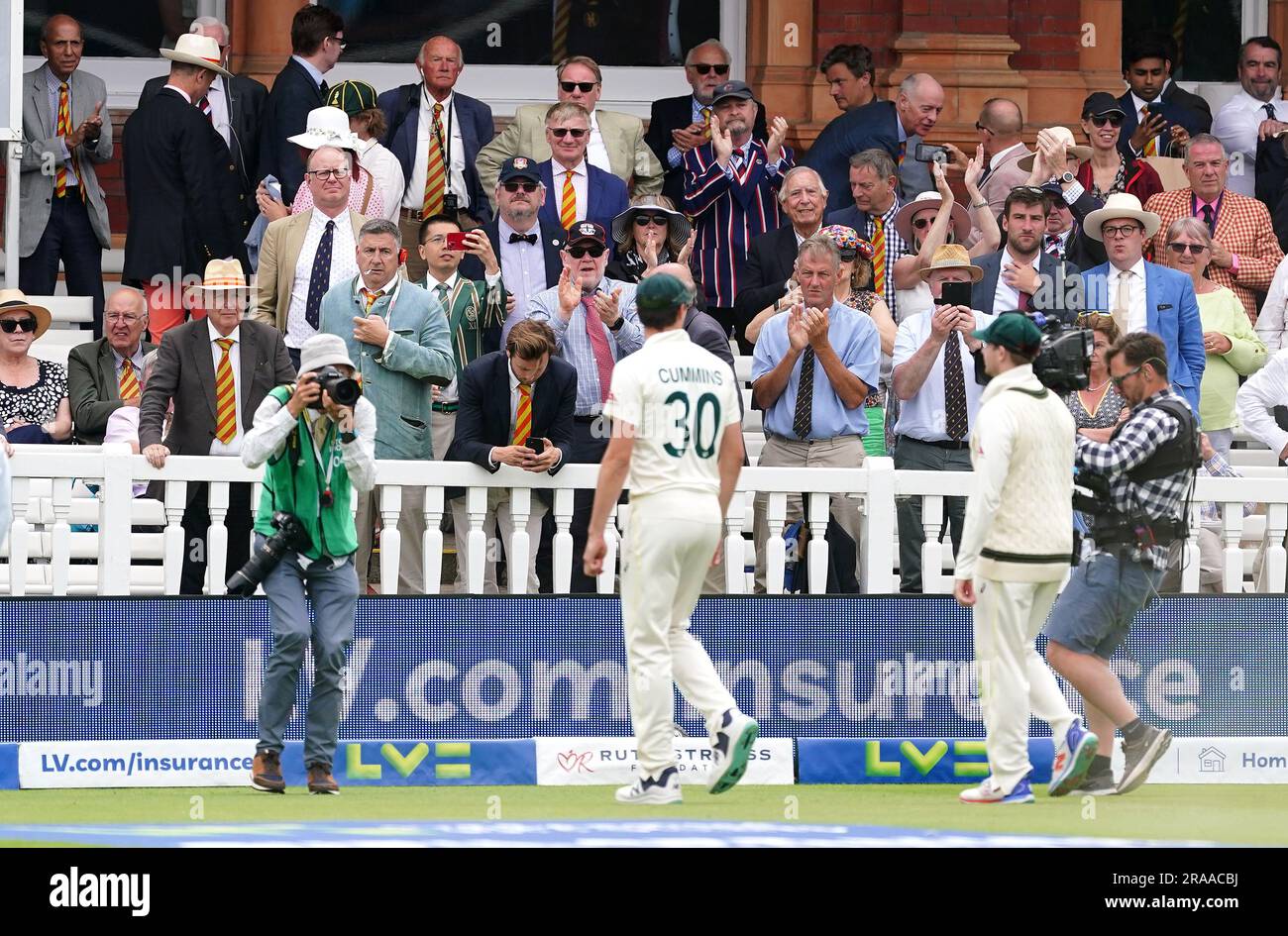 The members of the MCC react as Australia's Pat Cummins and Steve Smith ...