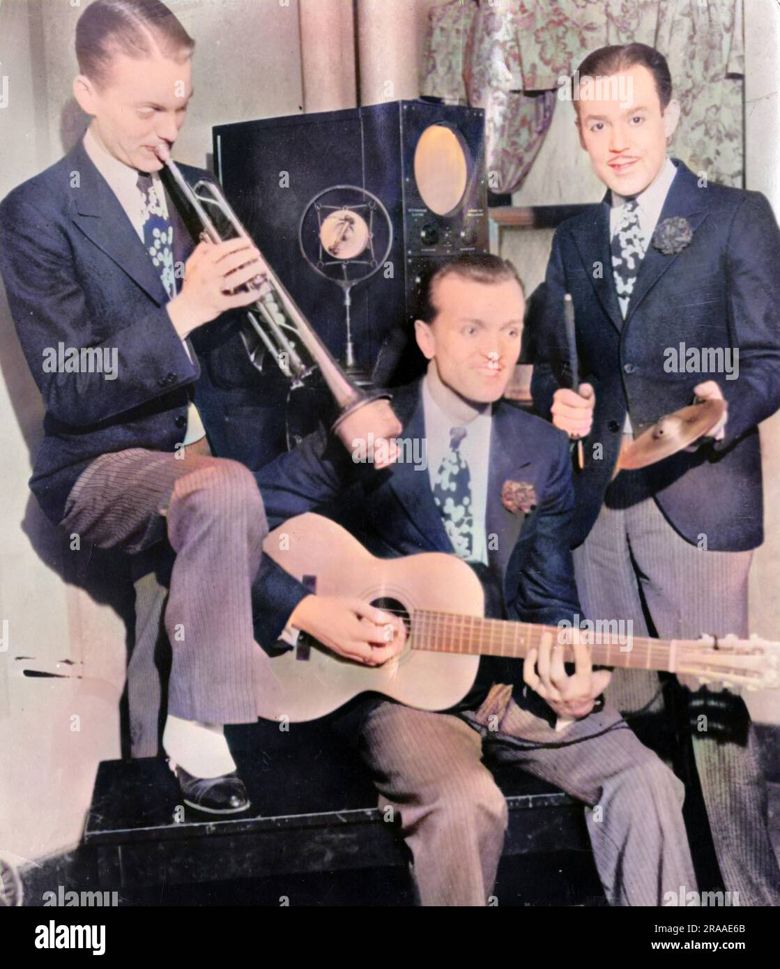Ray Kulz blows his trumpet, Jimmy Noel strums his guitar and George ...