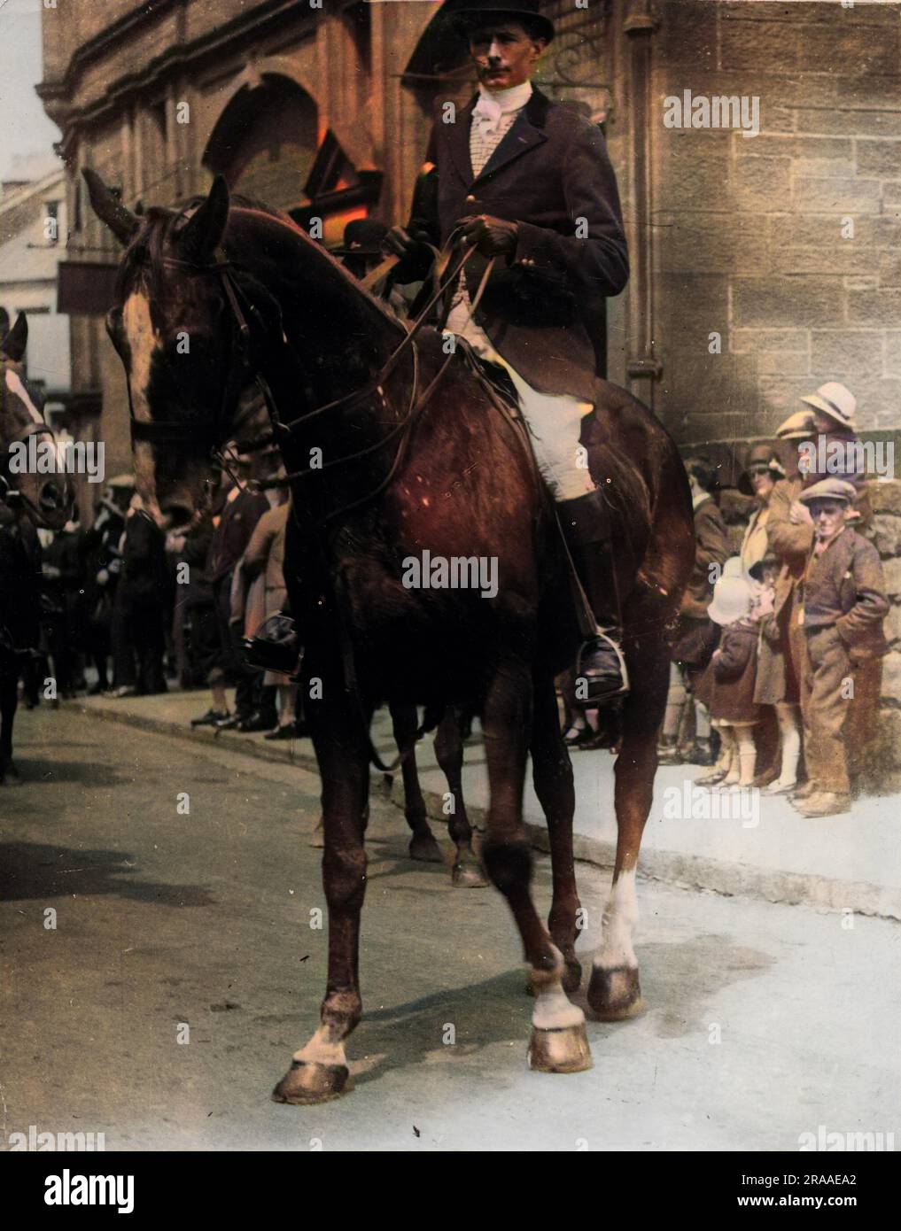 An Upper Class huntsman, on his horse at the fox meet, watched by a ...