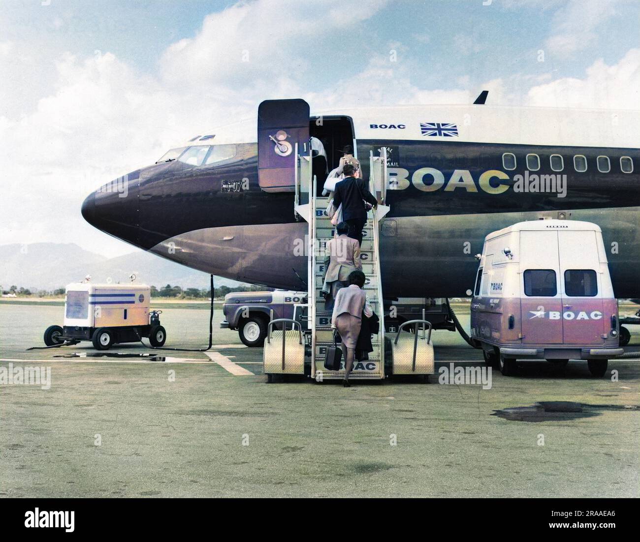 Passengers boarding a BOAC 707 aeroplane at Piarco Airport. Trinidad ...