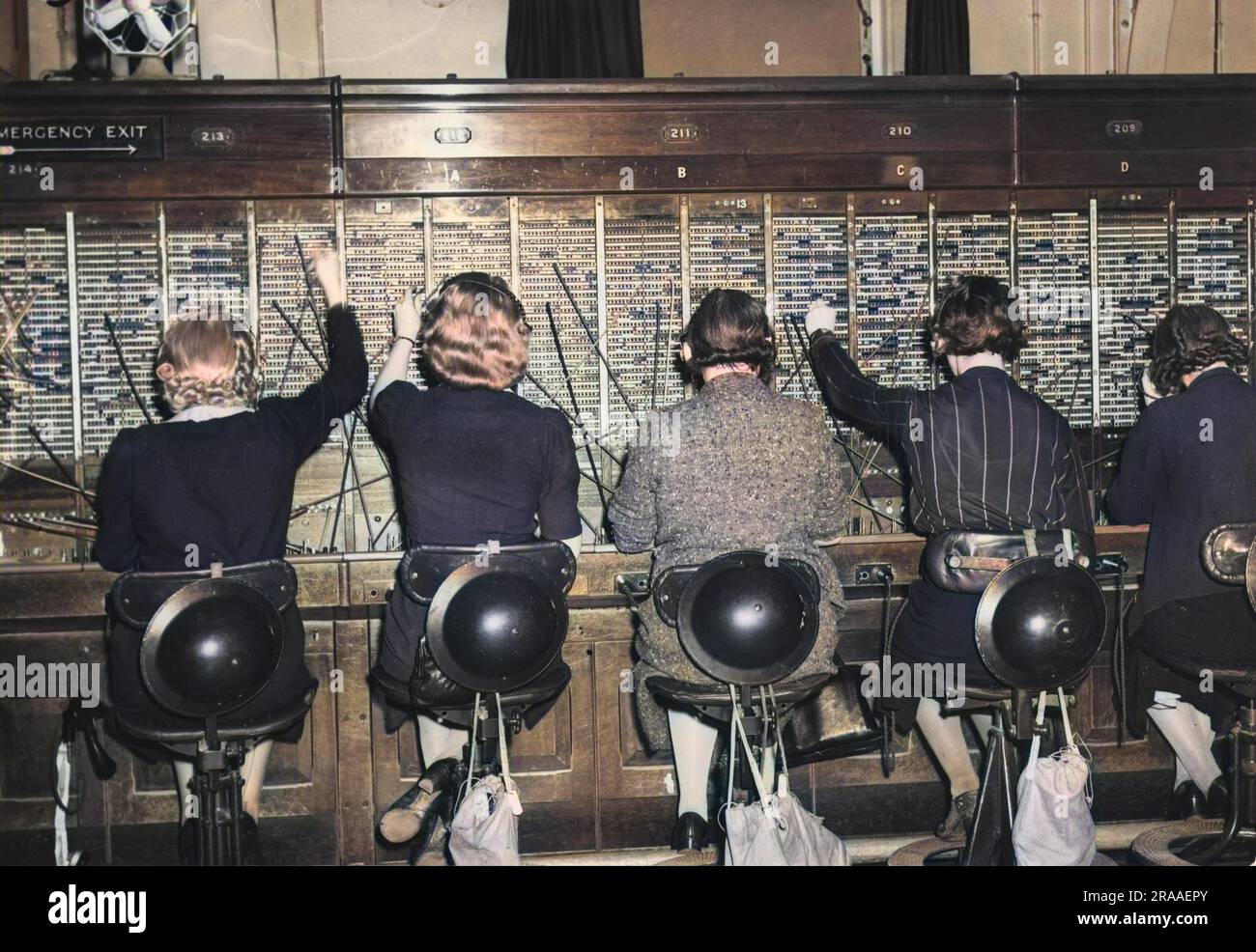 Women telephone operators at a London telephone exchange with tin ...