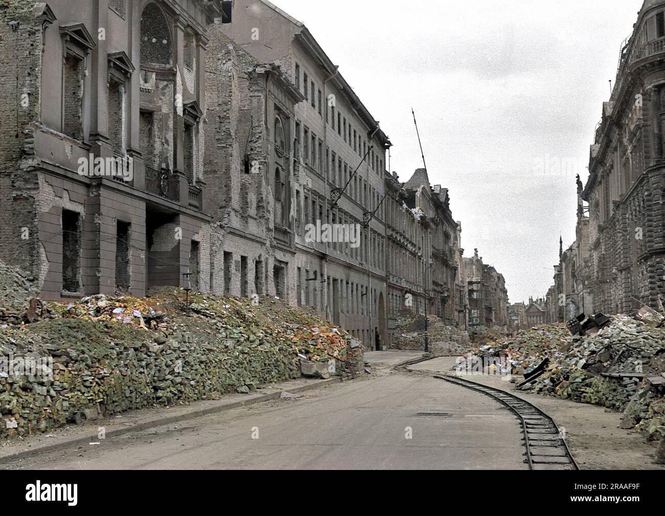 A bomb damaged street in Germany during the Second World War, with ...