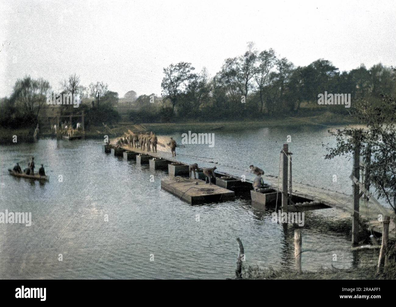 Soldiers constructing a Bailey Bridge across a river Stock Photo - Alamy