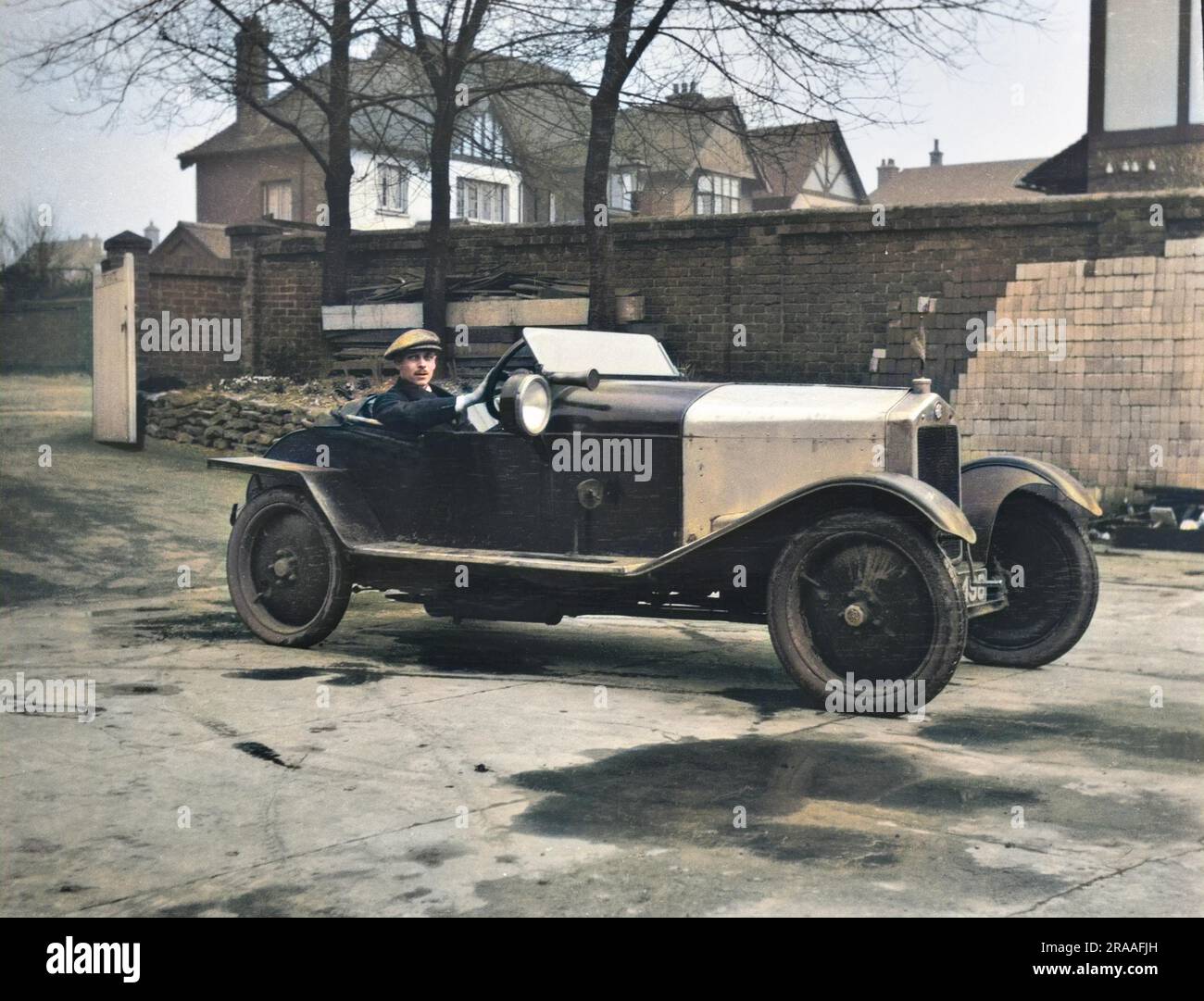 A man in an open-topped sports car Stock Photo - Alamy