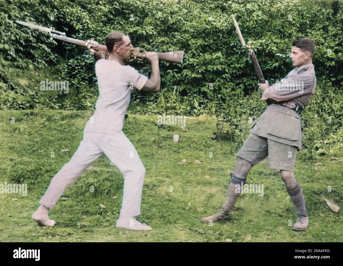 Two soldiers in a clearing, doing bayonet practice, India. Date: 1918 ...