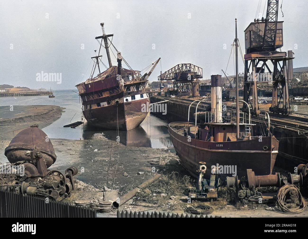 A harbour scene in Scotland with ships and various equipment, all ...