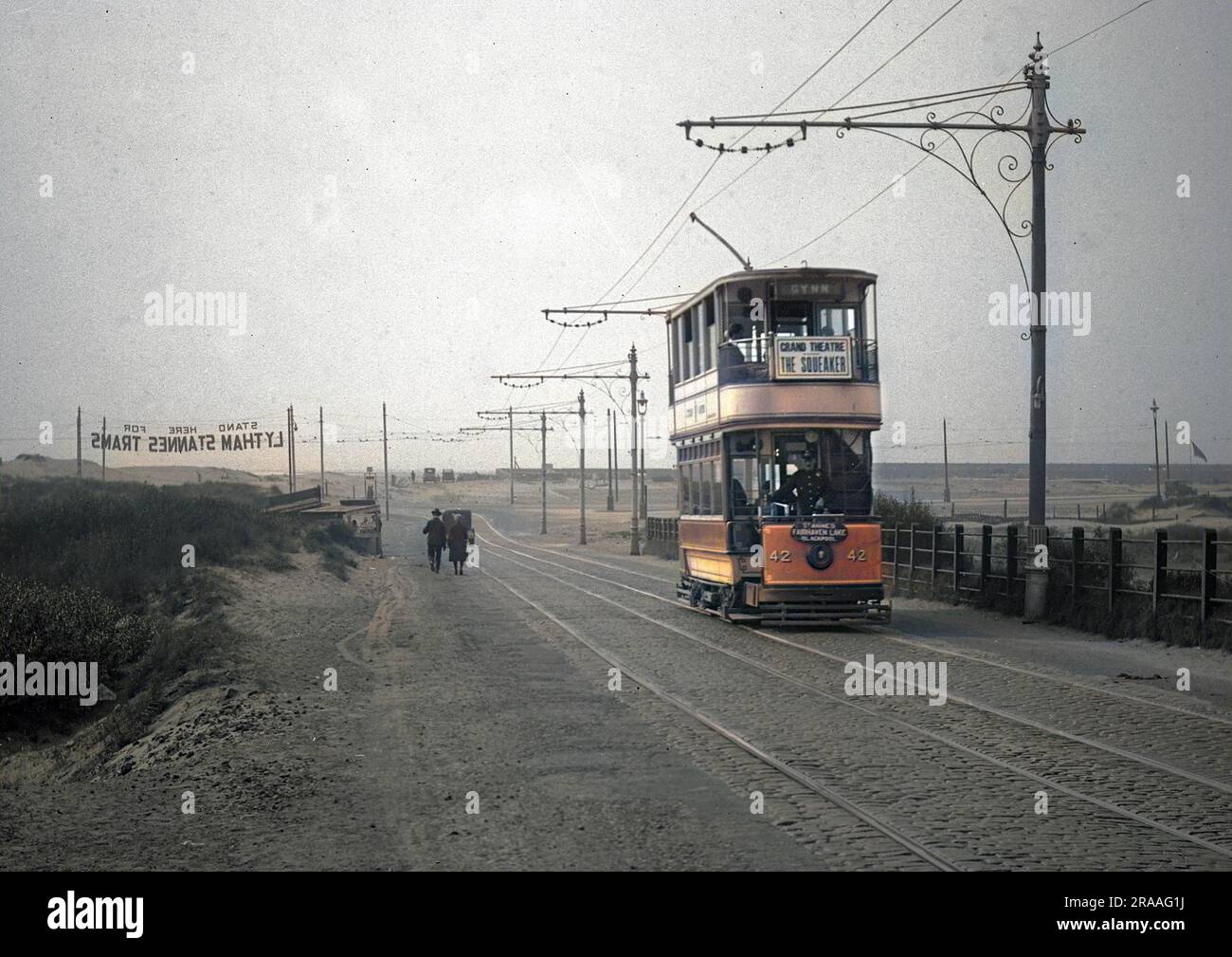 An electric tram on the road at Lytham St Annes, Lancashire, with the ...