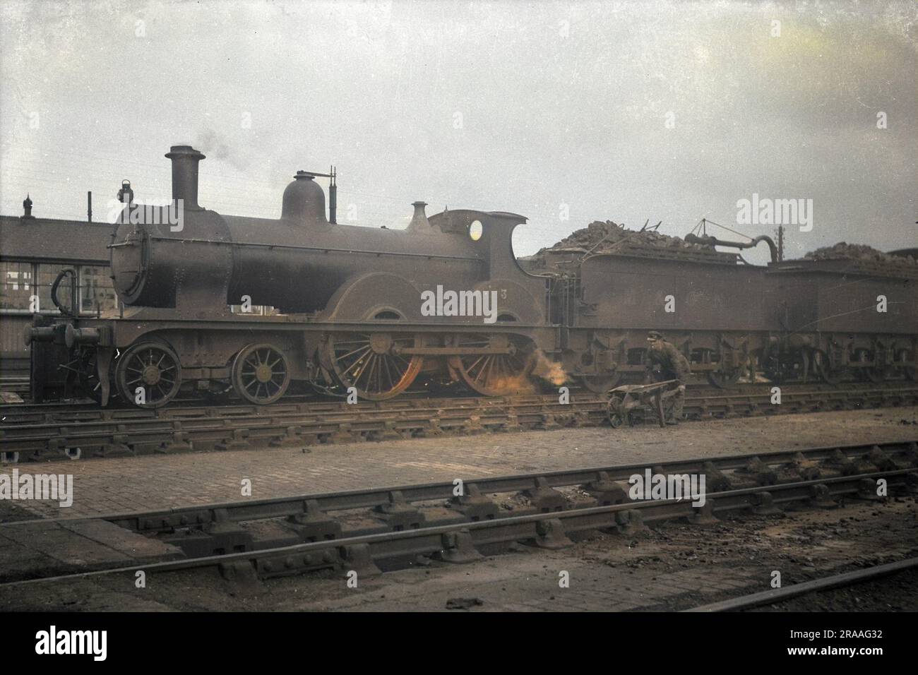 An M&GN (Midland and Great Northern) steam engine with trucks, and a ...