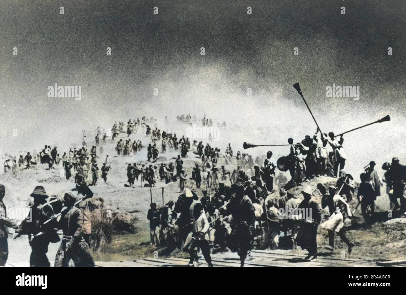 Hundreds of dust covered men heed the call of musicians atop a ...