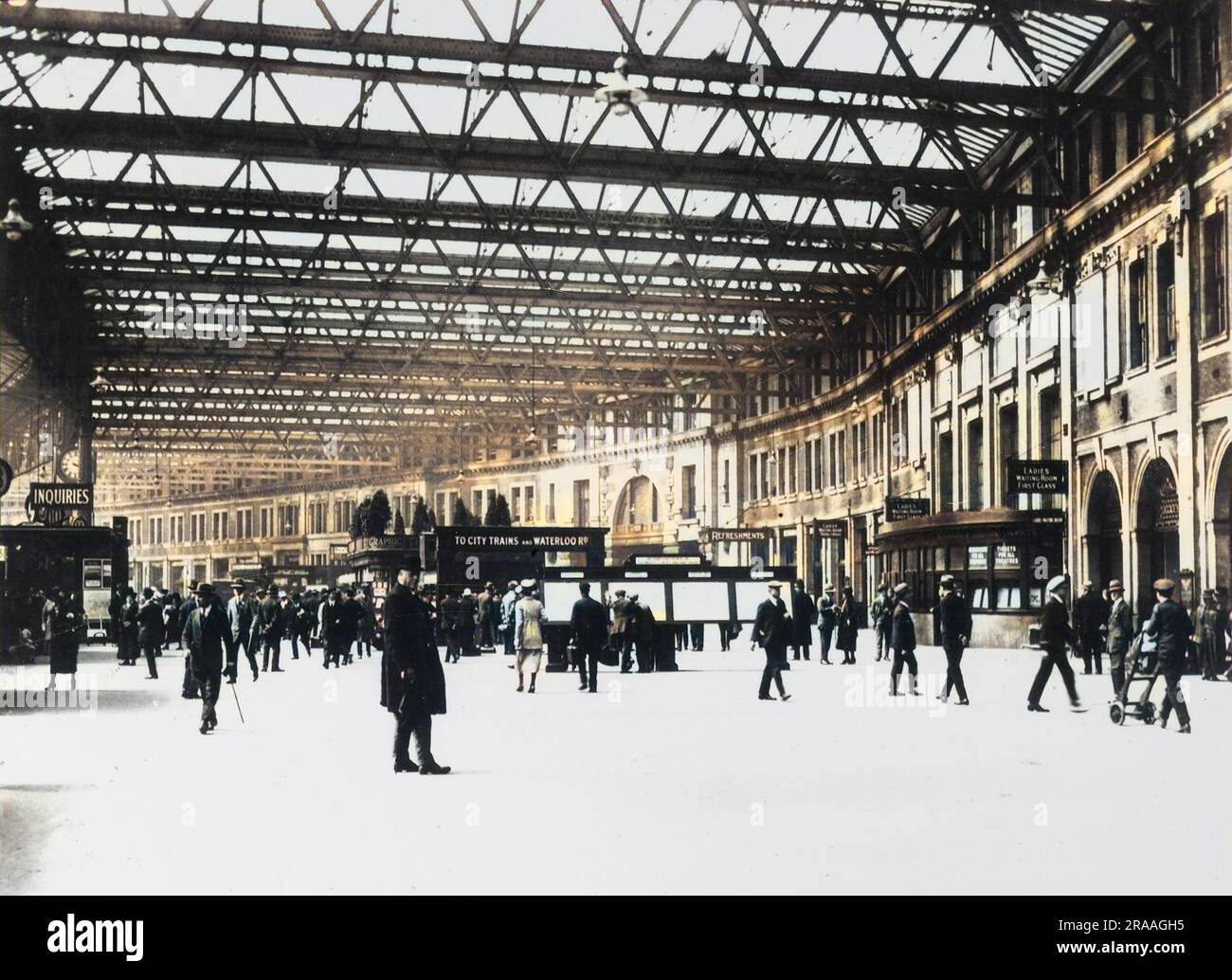 View inside Waterloo Station, London, with passengers coming and going ...