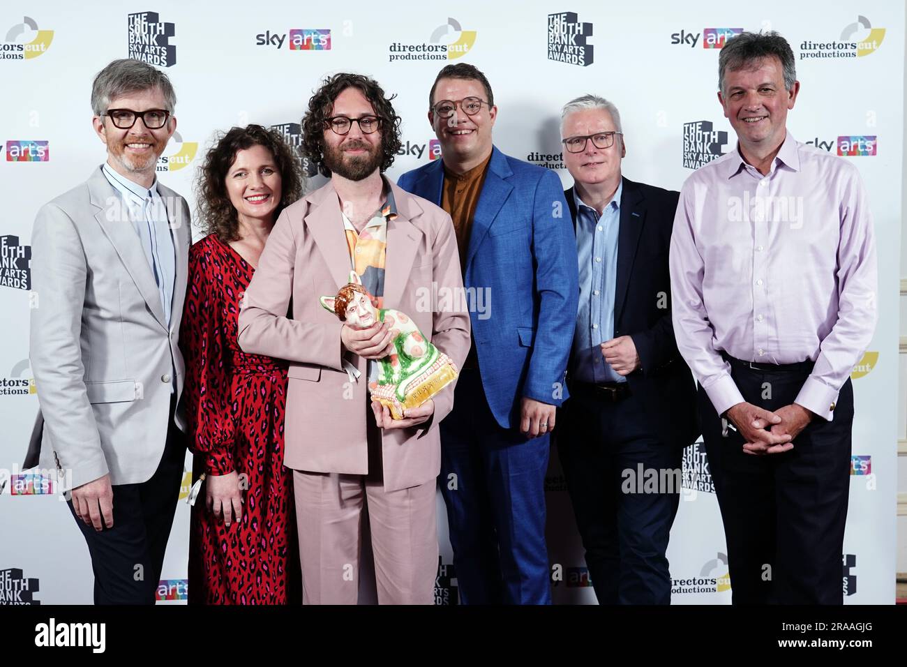 Gareth Malone (left) presents Gavin Higgins (third left) with the ...