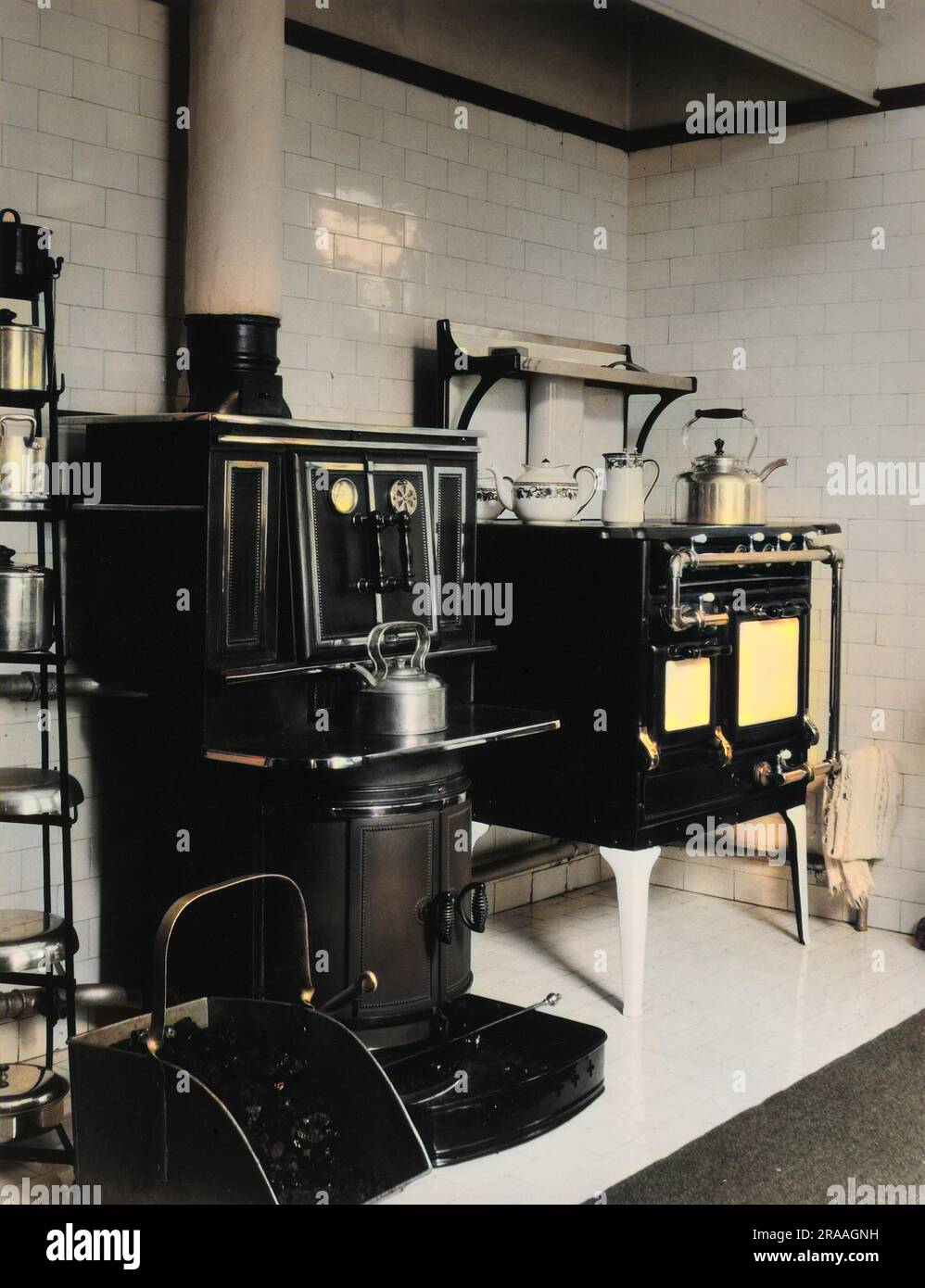 Corner of a large tiled kitchen, showing a gas cooker (right) and a ...