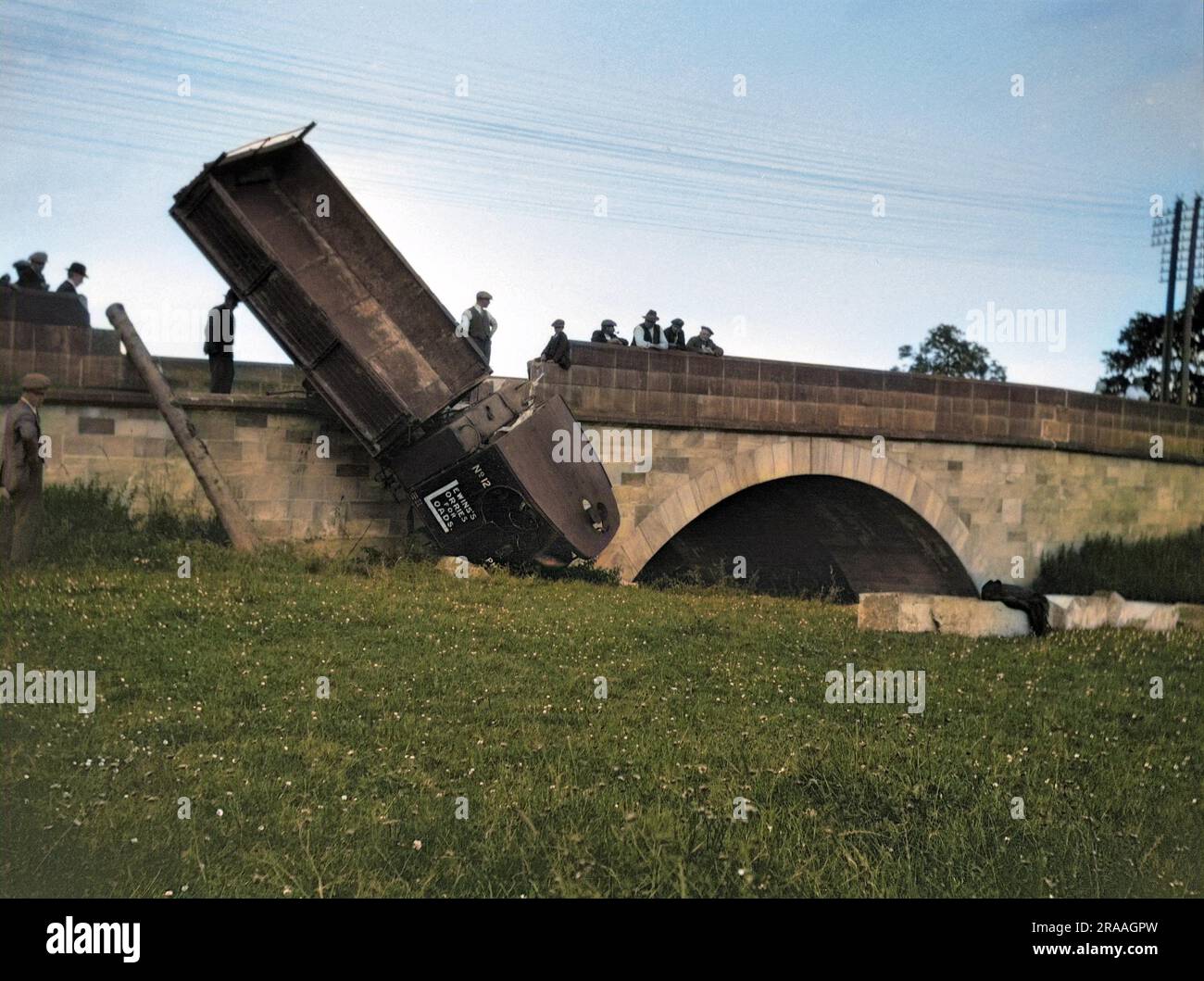 A lorry (Lewin's Lorries for Loads) which has fallen off a low bridge ...