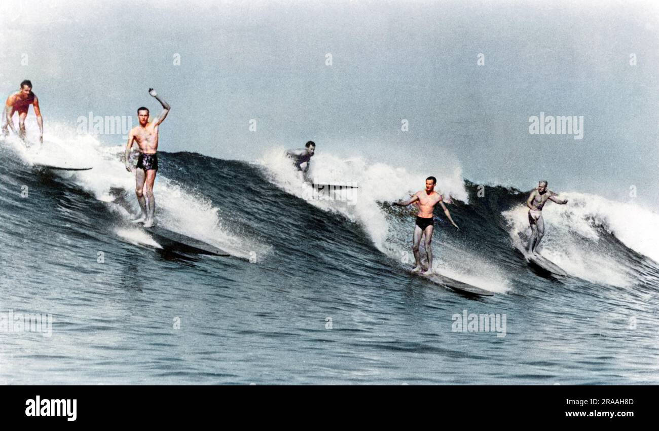 Surf riders on a big wave near San Clemente, California, USA. Date ...