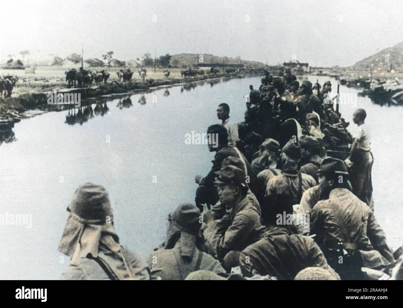 Japanese troops on a Chinese boat on the Quiantang River, in the ...