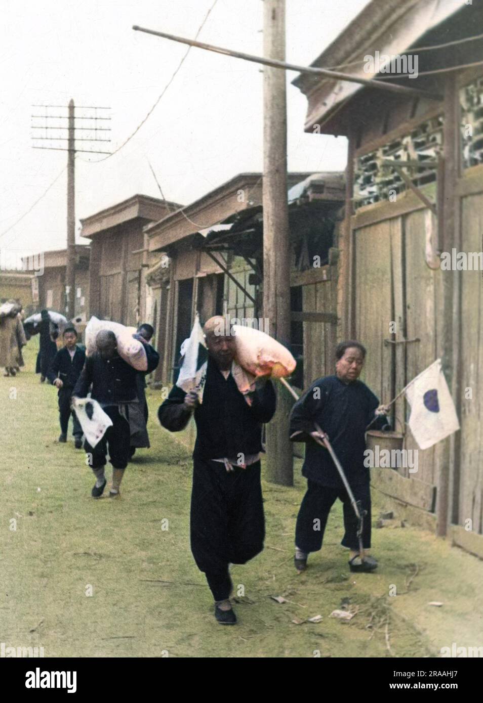 Chinese people in the captured city of Paoting (Baoding) are forced to ...