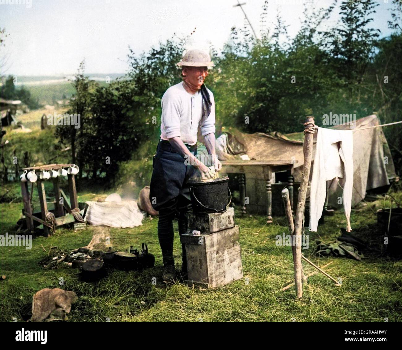 A British soldier washing clothes near the Western Front during World ...