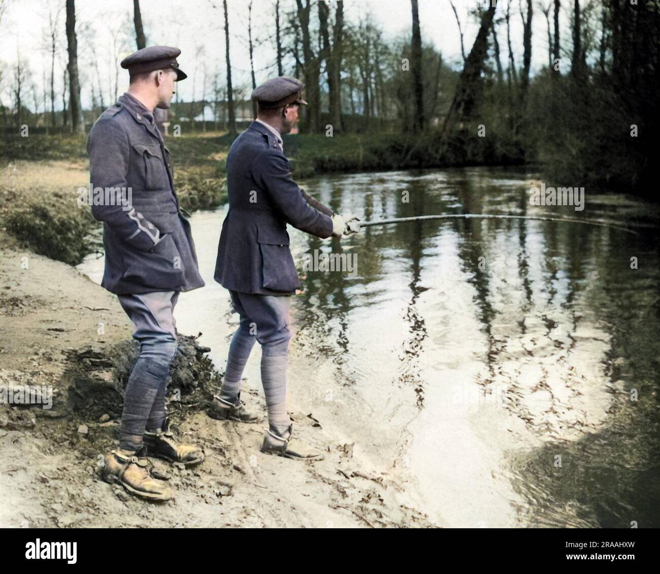 British cavalry officers resting by fishing in a river after fighting ...
