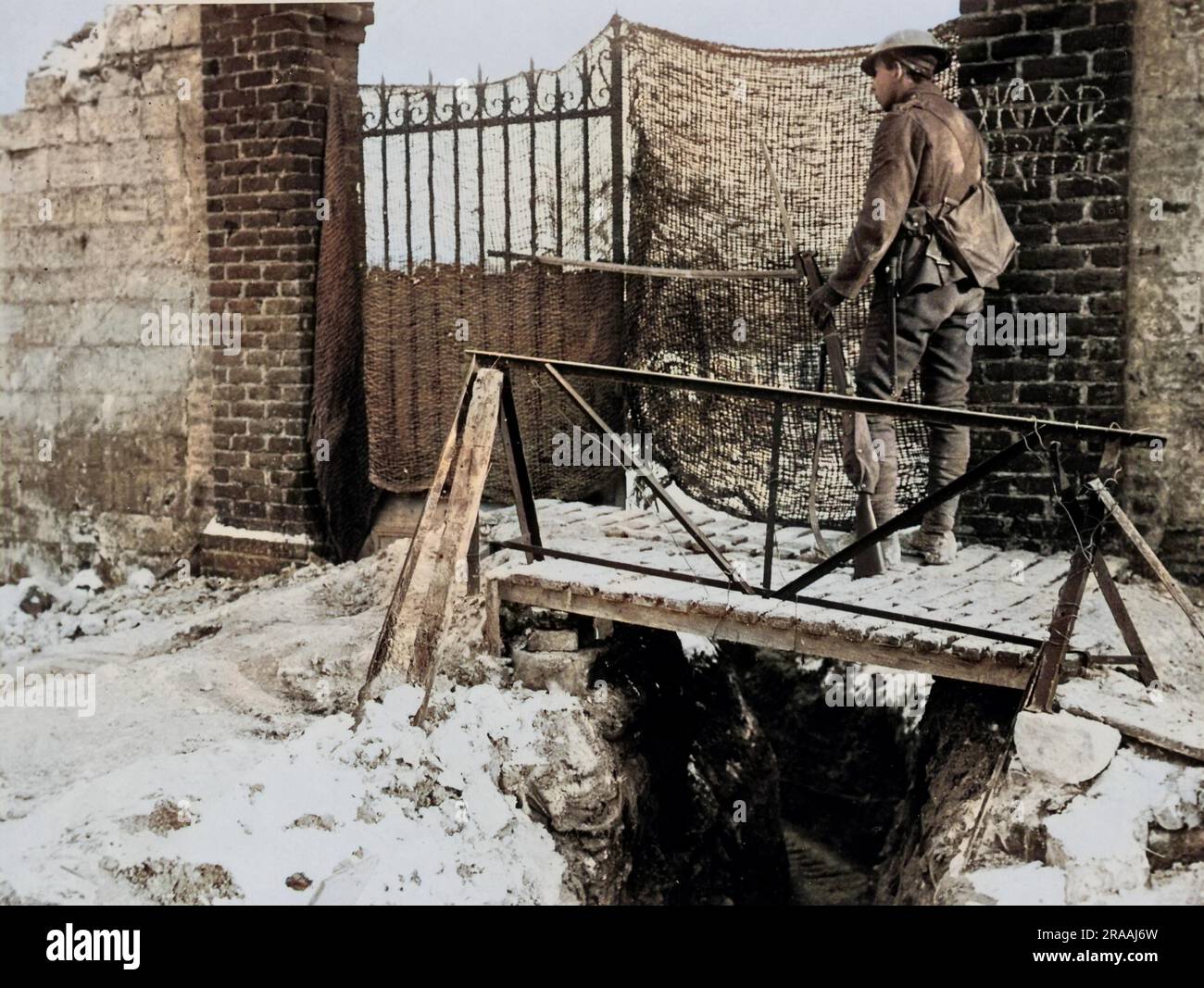 A British sentryman on duty in a ruined village on the Western Front ...