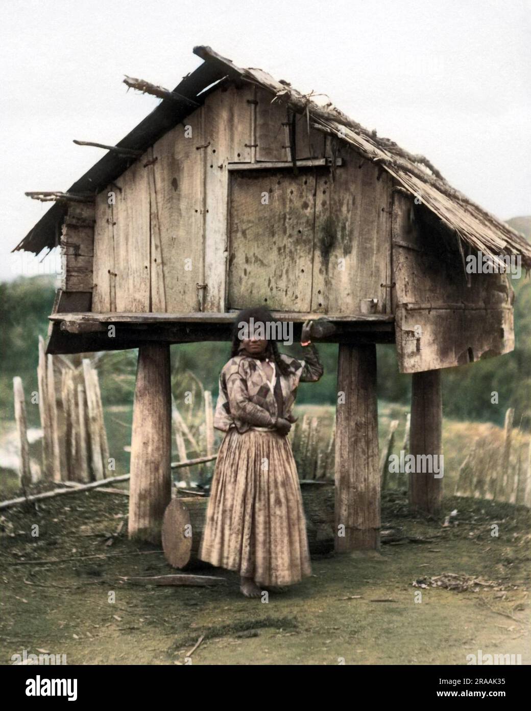 Maori woman outside hut on stilts, New Zealand. Date: circa 1890s Stock ...