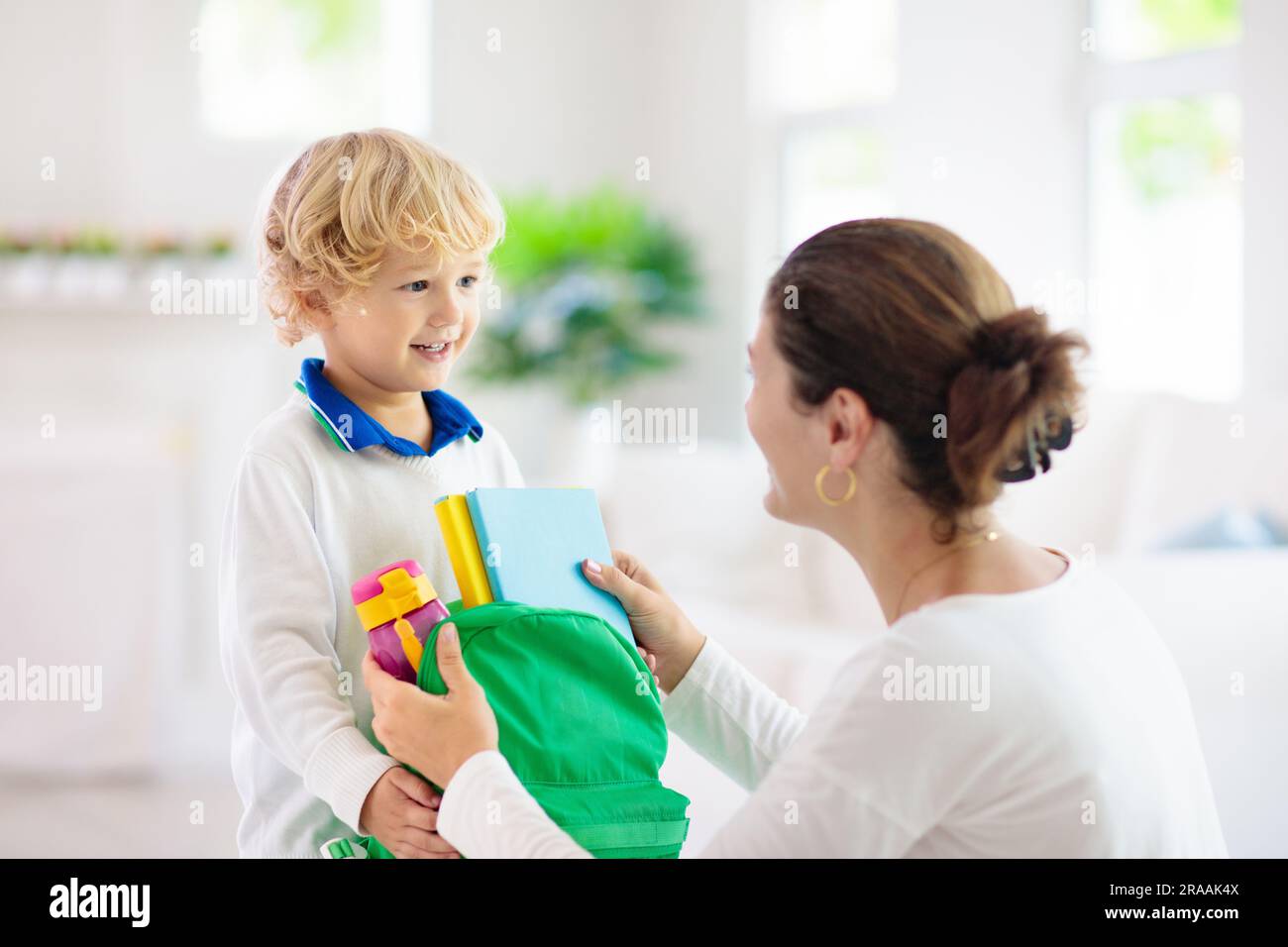 Child going back to school. Mother and kid getting ready for first ...