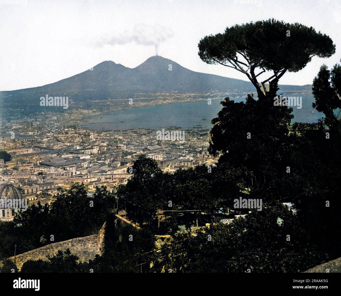 View of Naples, Italy, with smoke emerging from Mount Vesuvius in the ...