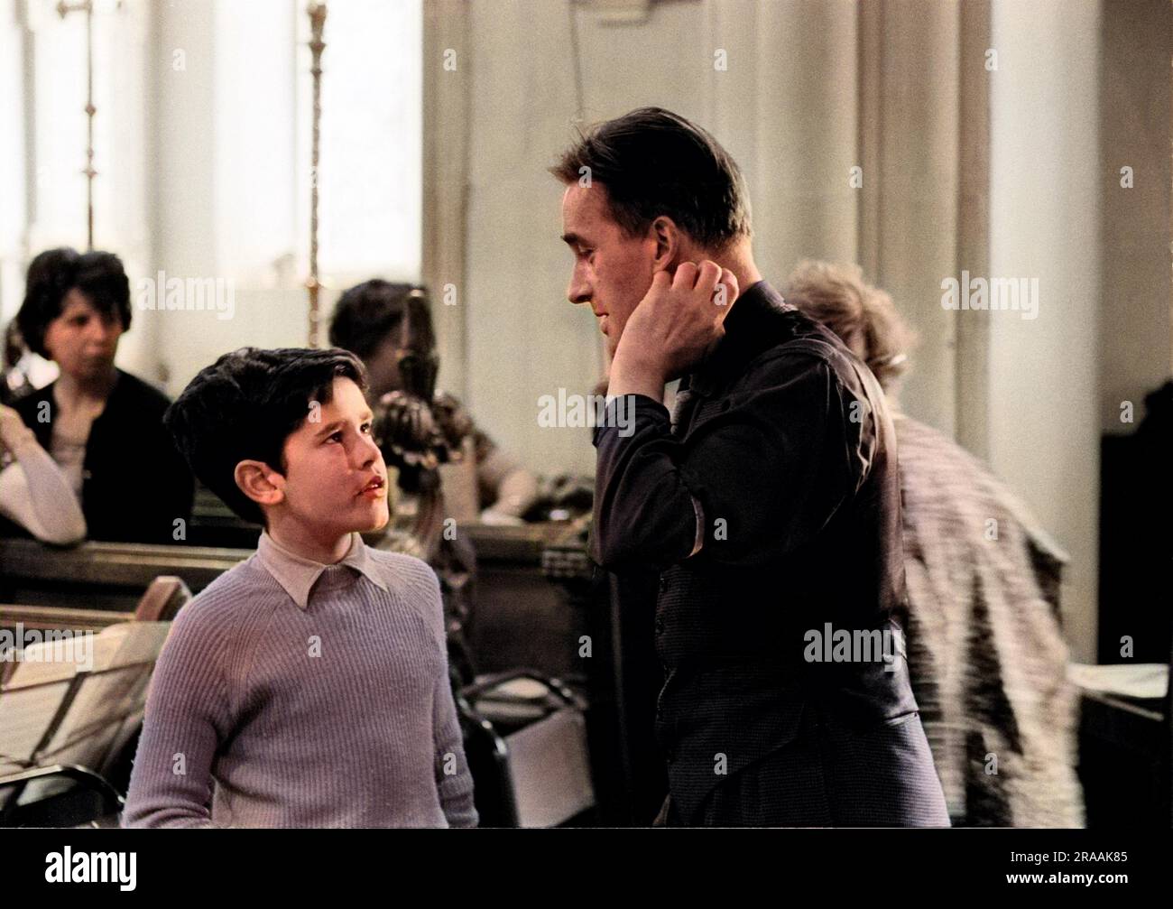 George Malcolm talking with David Pinto (treble) during rehearsals for ...